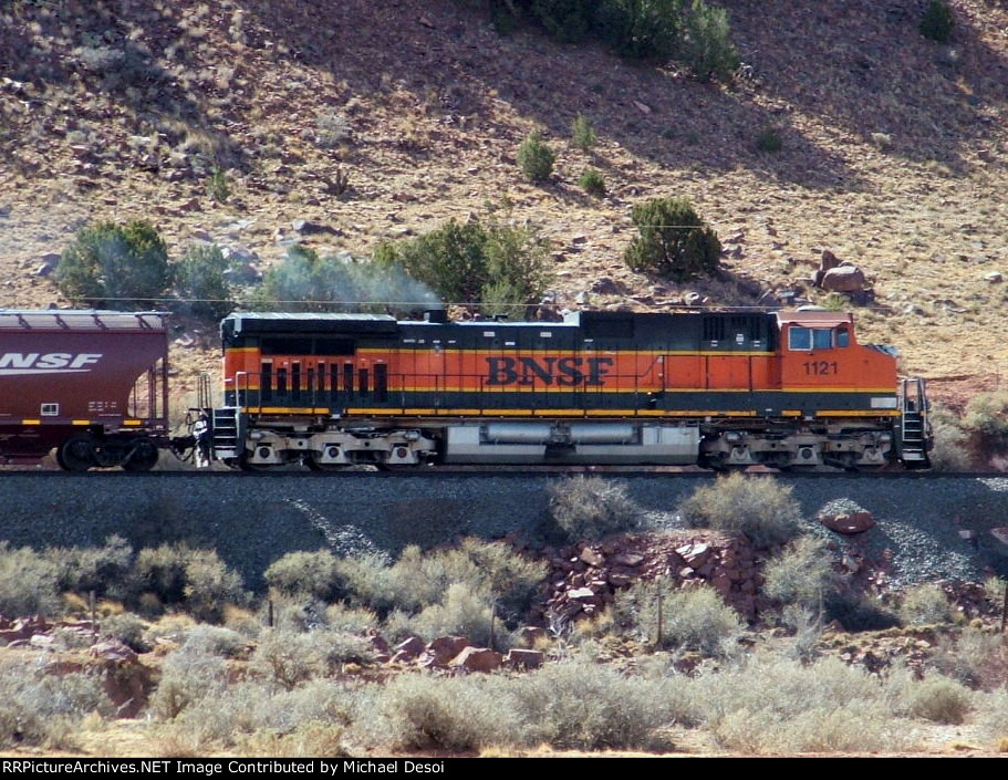 BNSF C44-9W #1121 leads a westbound grain train through Abo Canyon